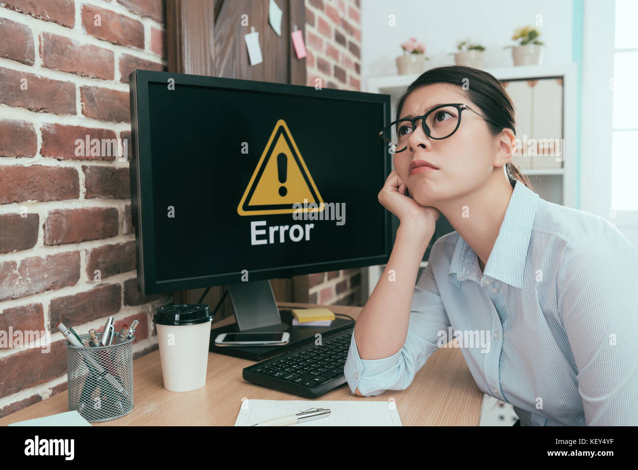 depressed office worker lady sitting in front of error computer ...