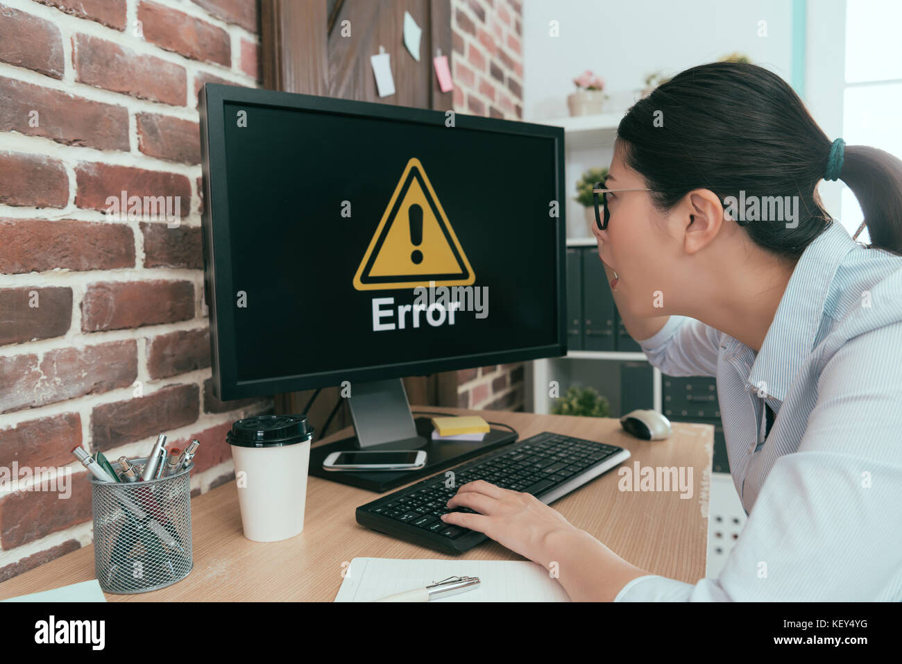 beautiful elegant business woman looking at computer error information ...