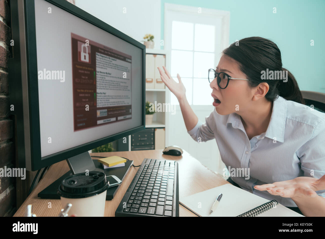 puzzled unhappy business manager looking at computer screen showing ...