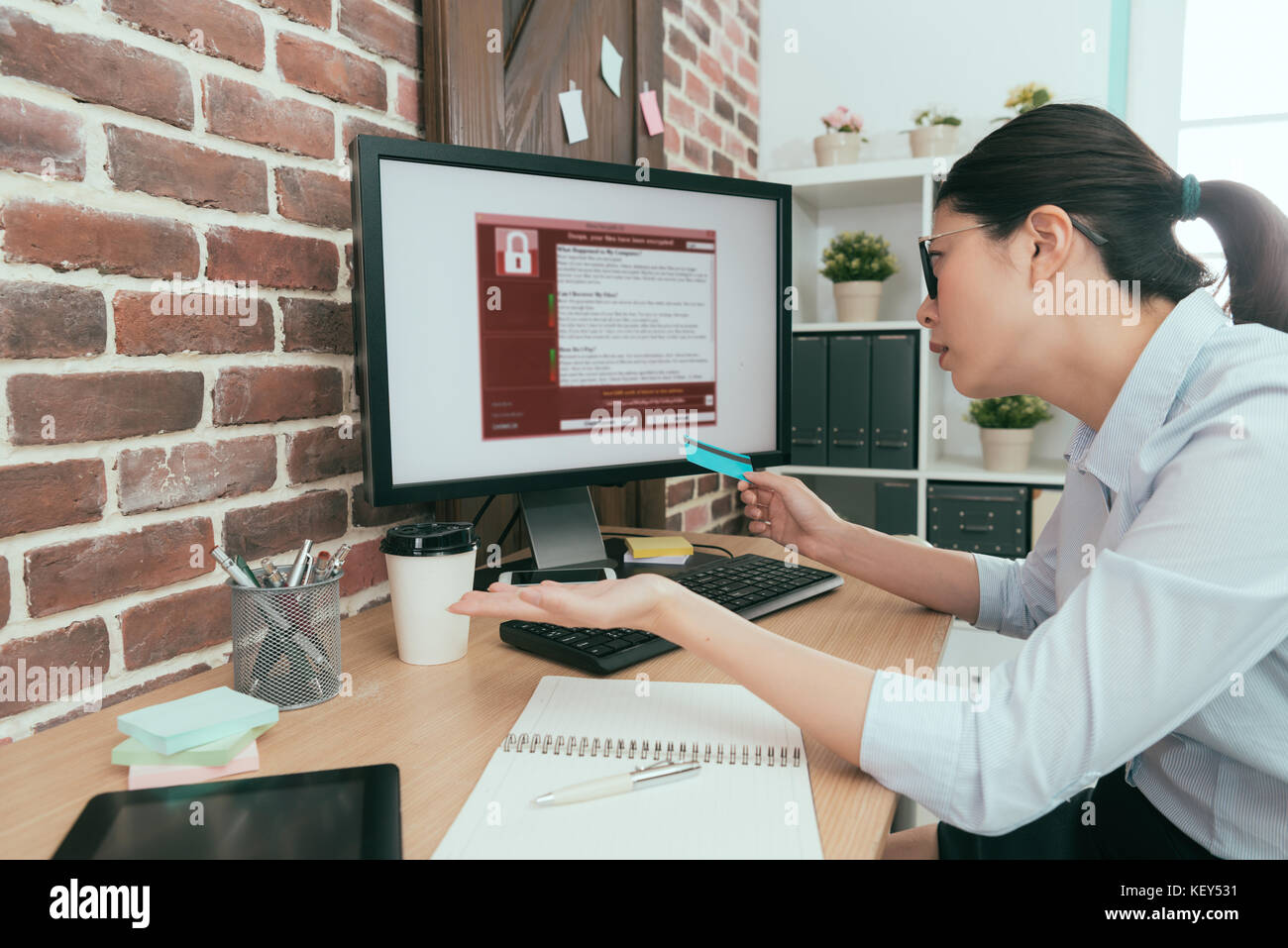 Office worker using computer unhappy hi-res stock photography and ...