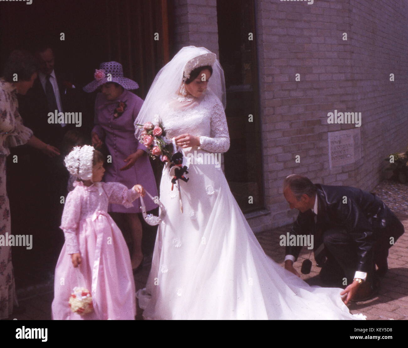 Bride has adjustments before official wedding photos. July 1974 ...
