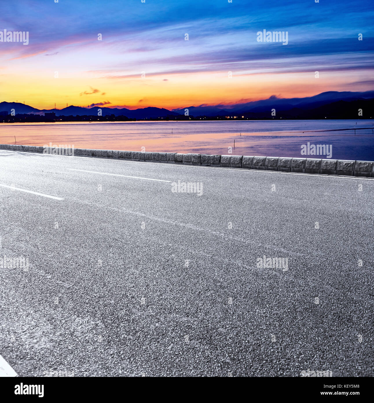 Asphalt road along mountains hi-res stock photography and images - Alamy