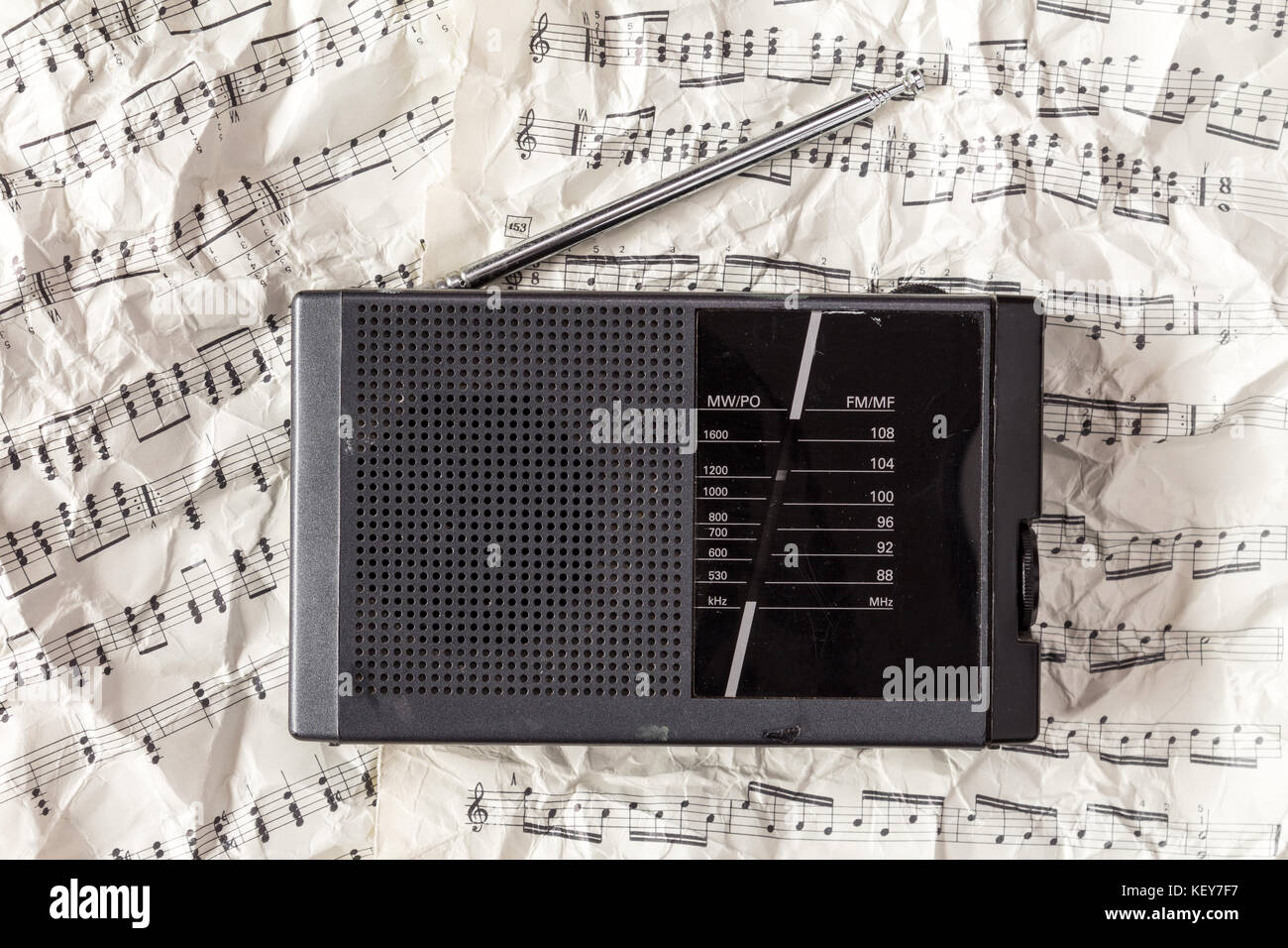 Old scratched radio receiver on the crumpled notes background Stock ...