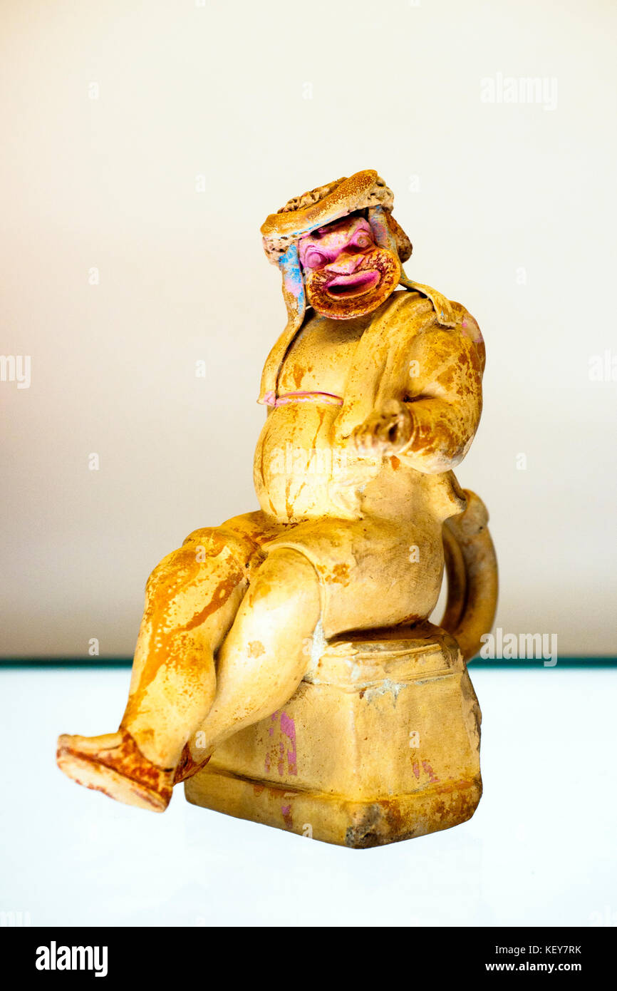 Flask in the form of a comic actor seated on an altar, perhaps Priam at ...