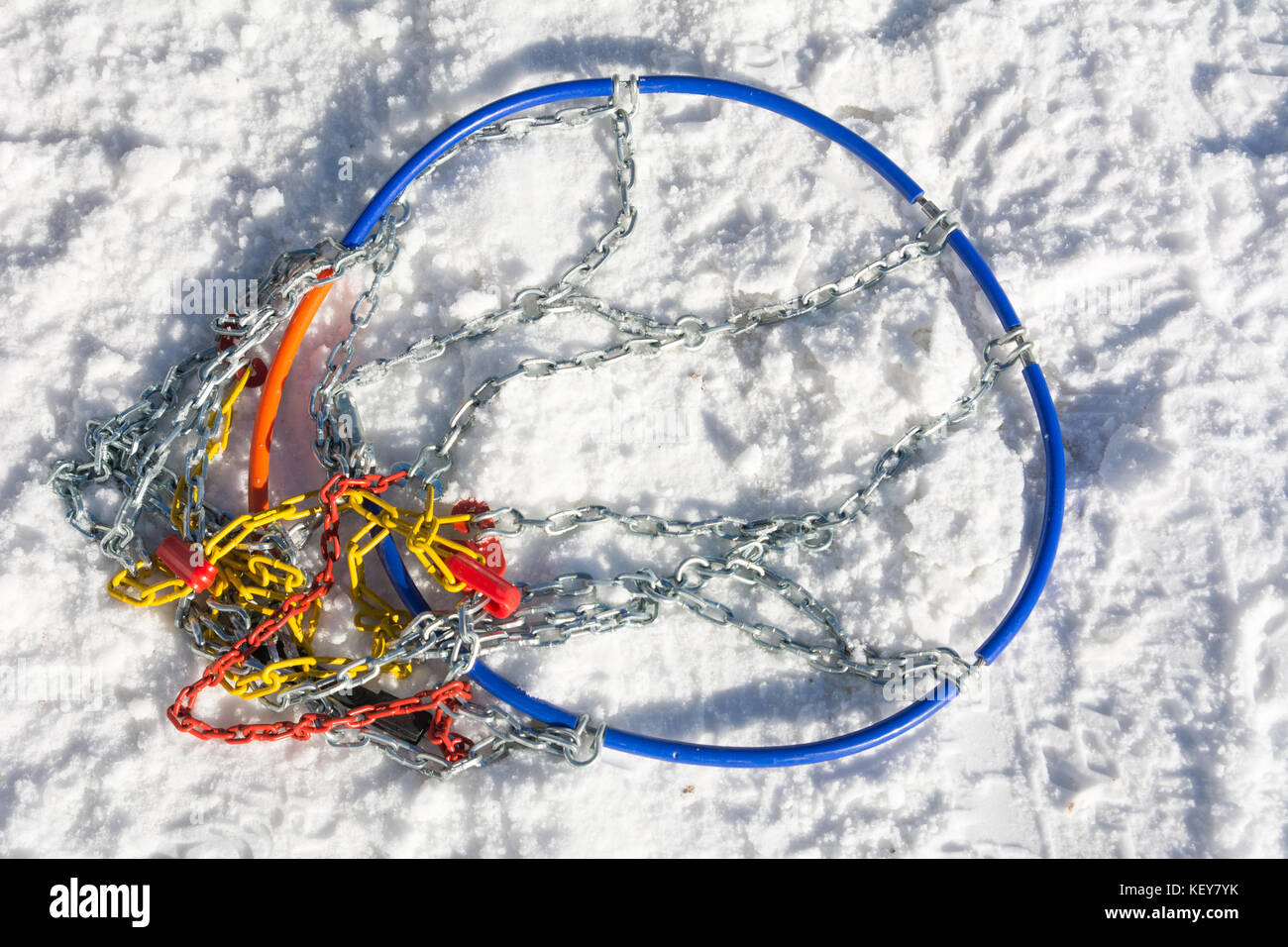 Snow chains on the road ready to be mounted Stock Photo - Alamy