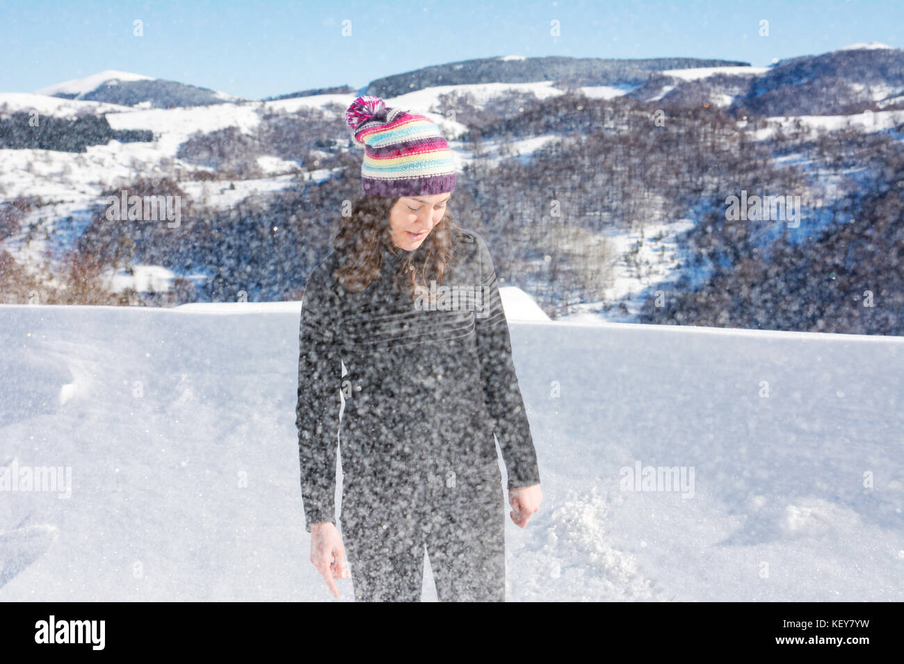 Woman standing in heavy snow blizzard on the mountain Stock Photo - Alamy