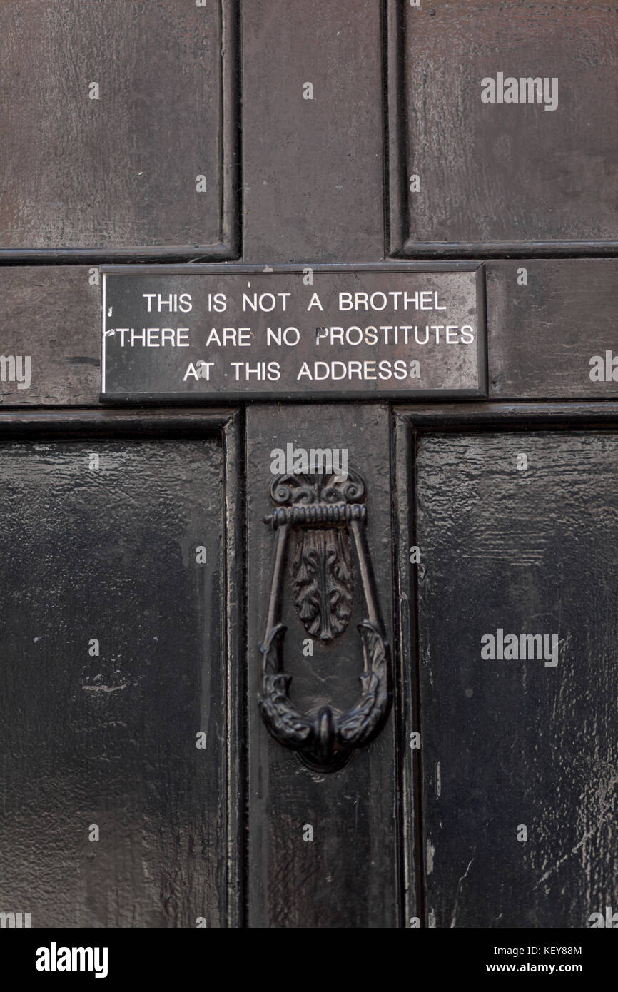 Sign on door saying: This is not a Brothel There are no prostitutes ...