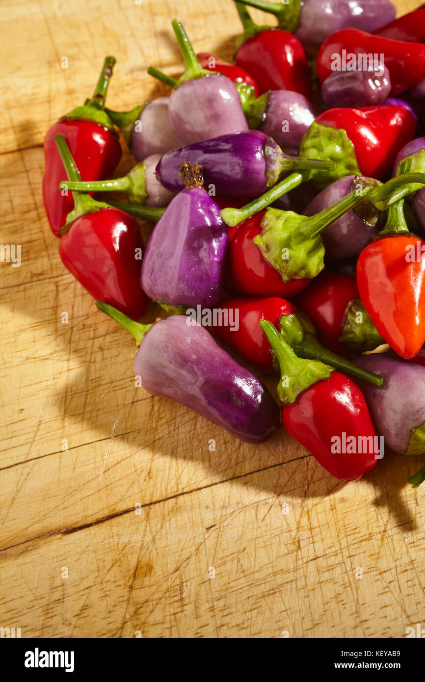 whole, fresh, tiny red and purple hot peppers Stock Photo - Alamy