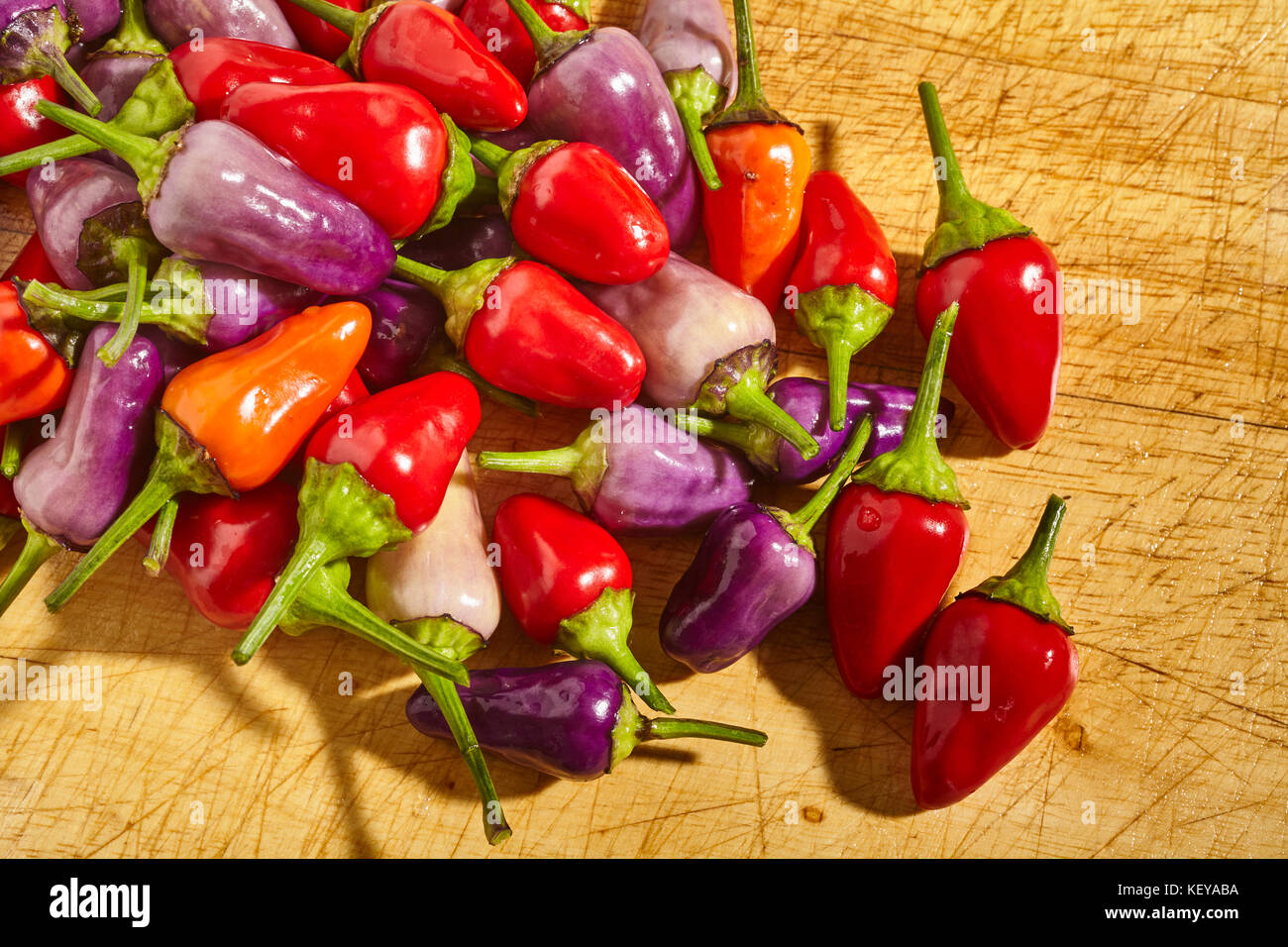 whole, fresh, tiny red and purple hot peppers Stock Photo - Alamy