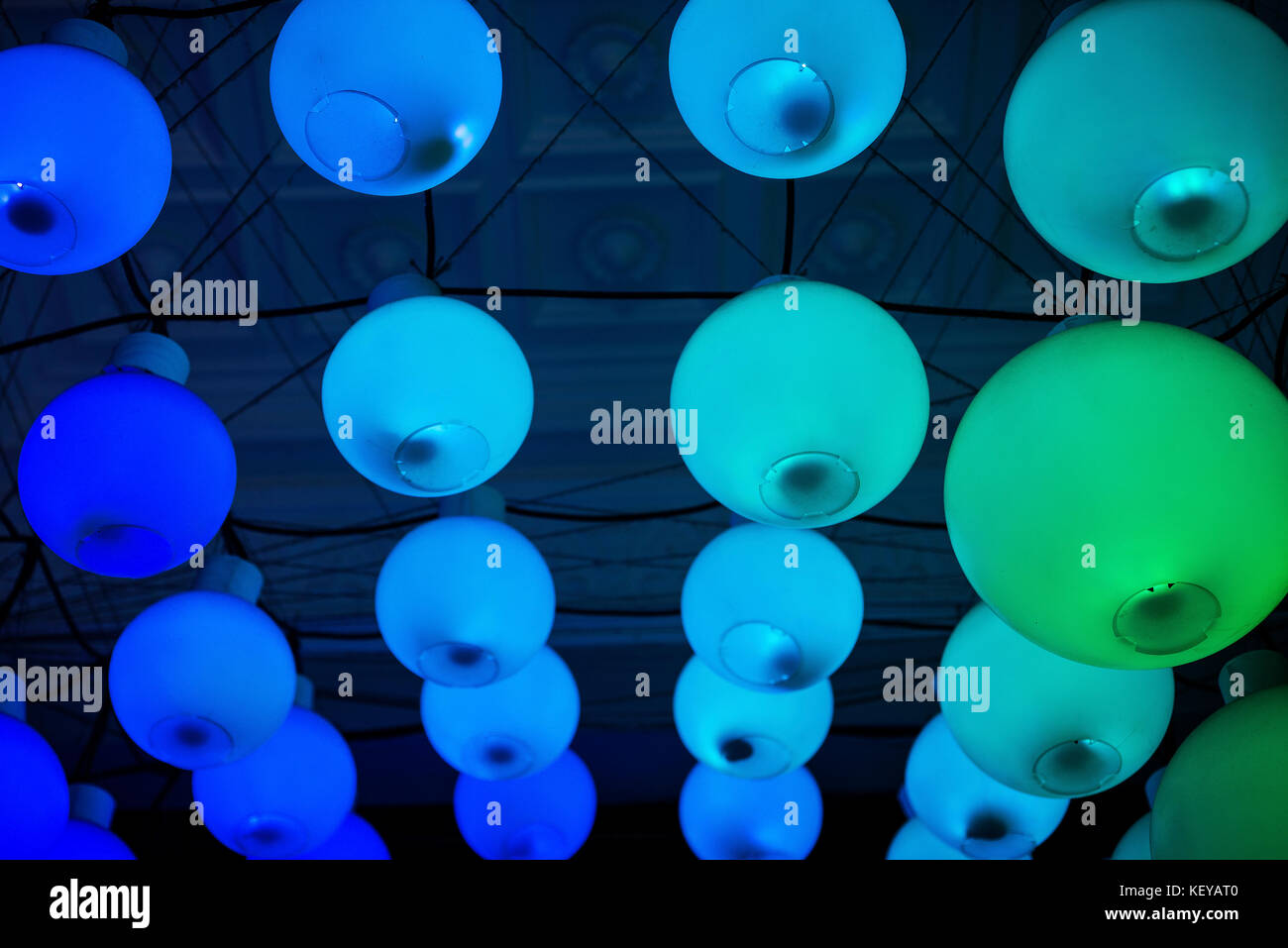 colourful blue round lights in funky modern interior design detail ...