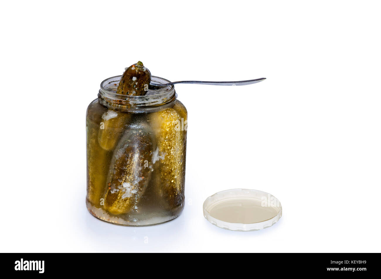 Pulling the first pickle out of a jar Stock Photo - Alamy