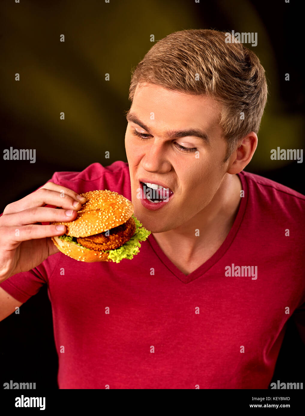 Man eat hamburger. Fastfood and junk food concept Stock Photo - Alamy