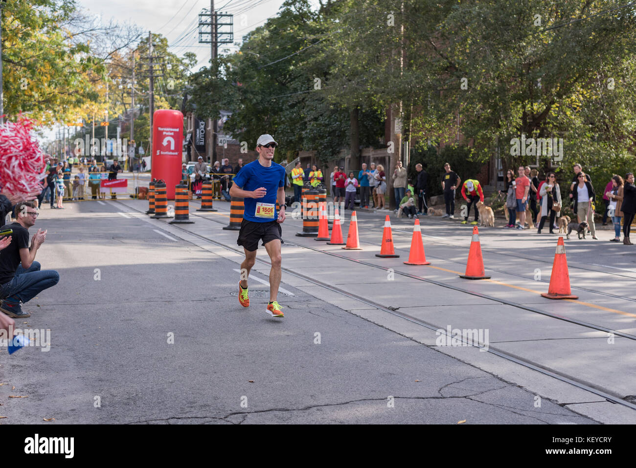TORONTO, ON/CANADA - OCT 22, 2017: Marathon runner Simon passing the ...
