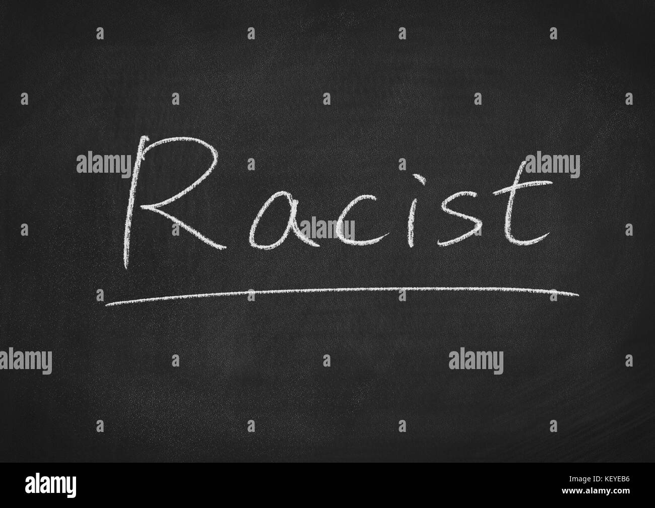 racist concept word on a blackboard background Stock Photo - Alamy