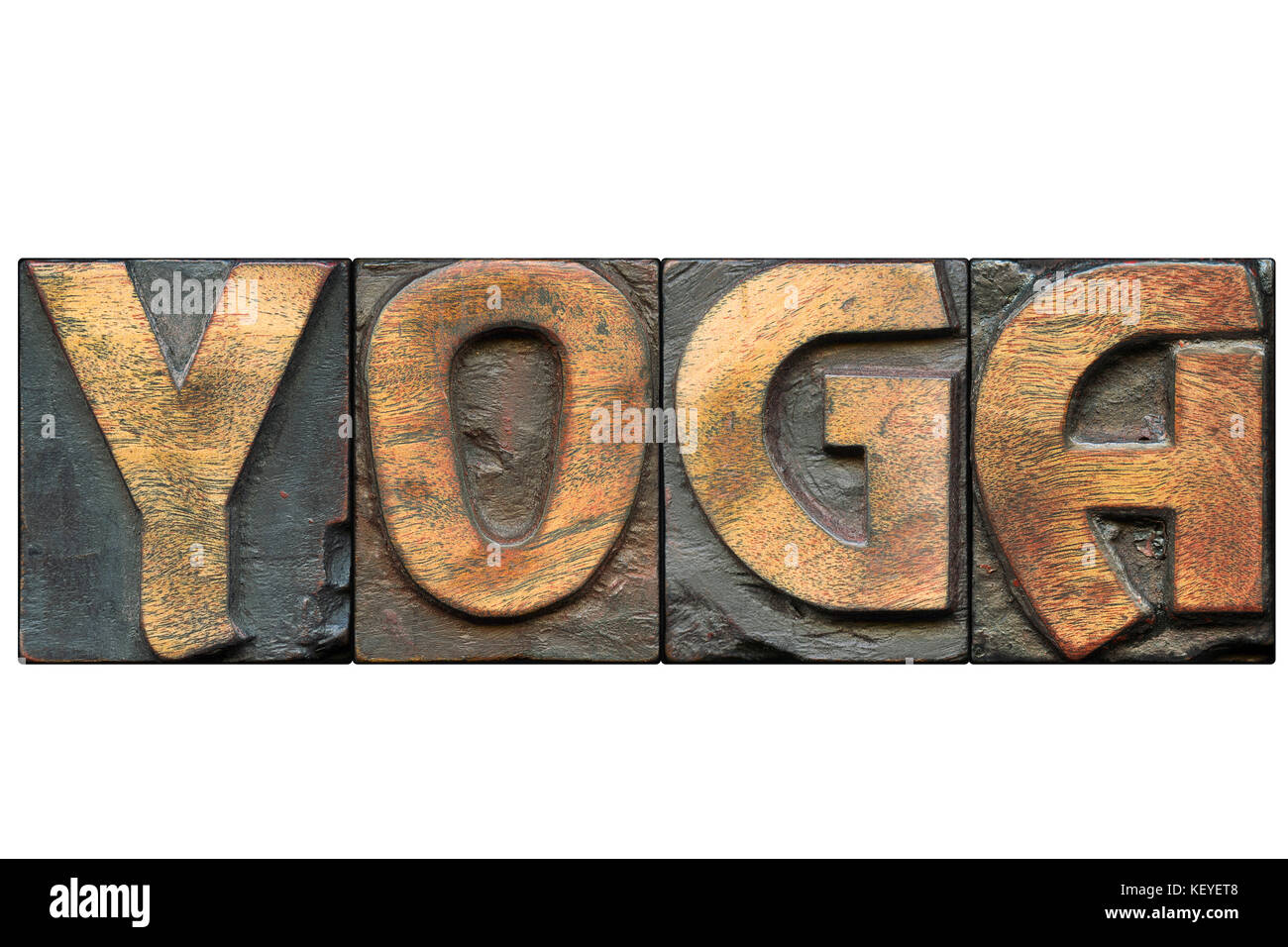 yoga word made from vintage bold letterpress blocks isolated on white ...