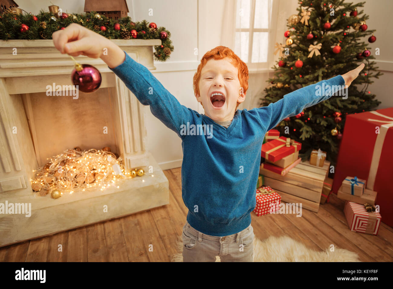 Crazy little boy getting excited over christmas Stock Photo - Alamy