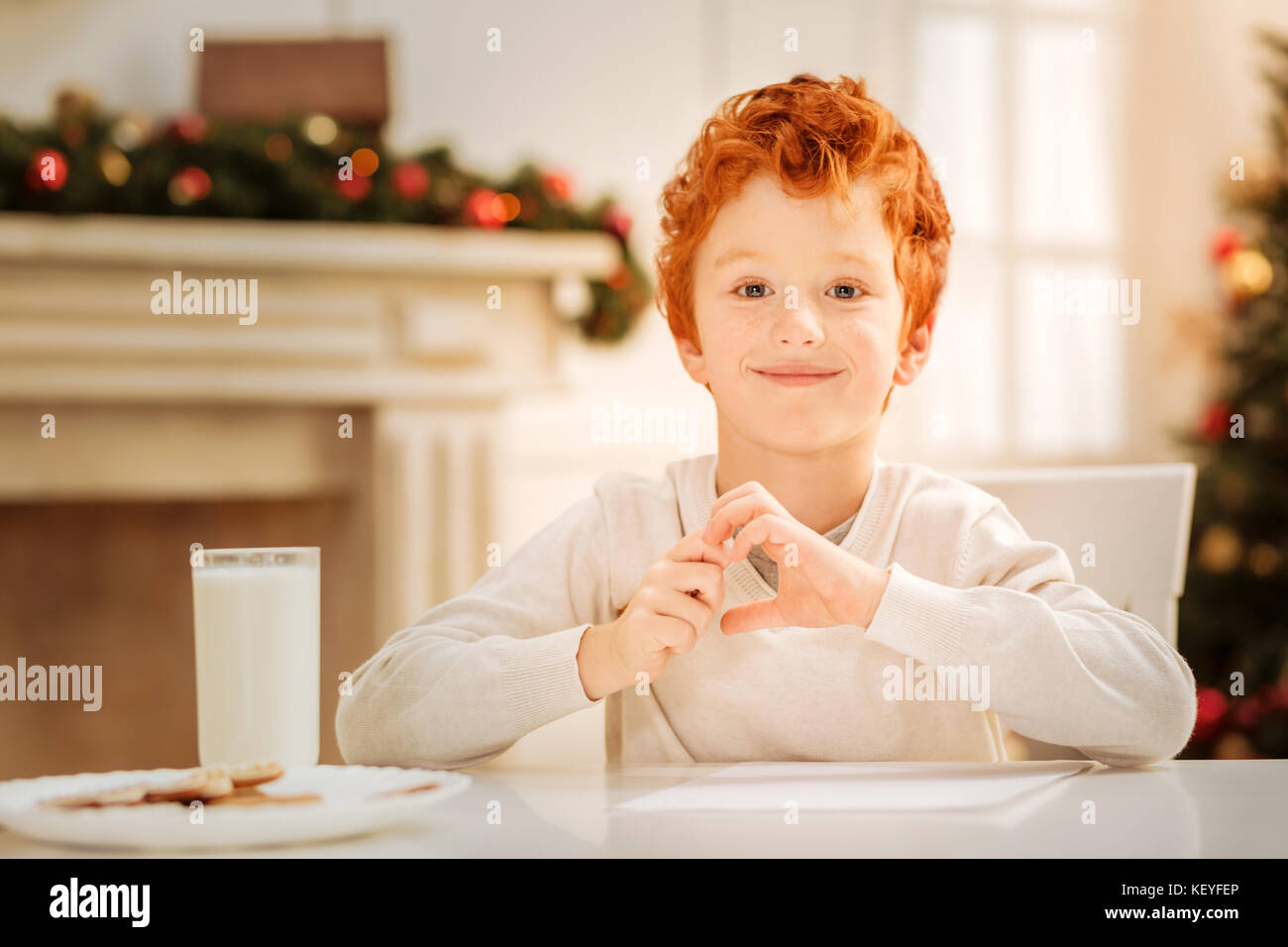 Adorable ginger kid beaming into camera Stock Photo - Alamy