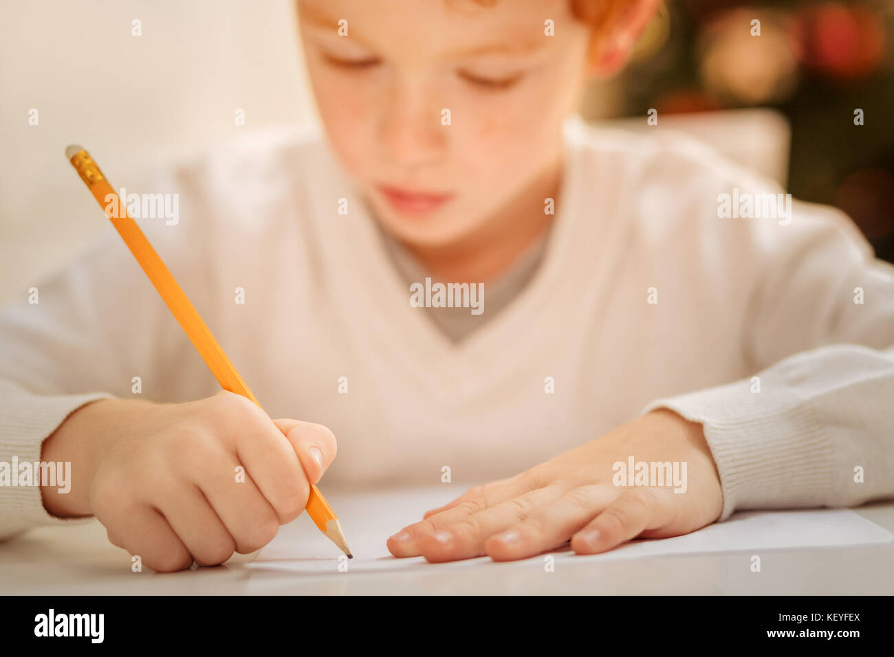 Close up of focused child writing letter to santa claus Stock Photo - Alamy