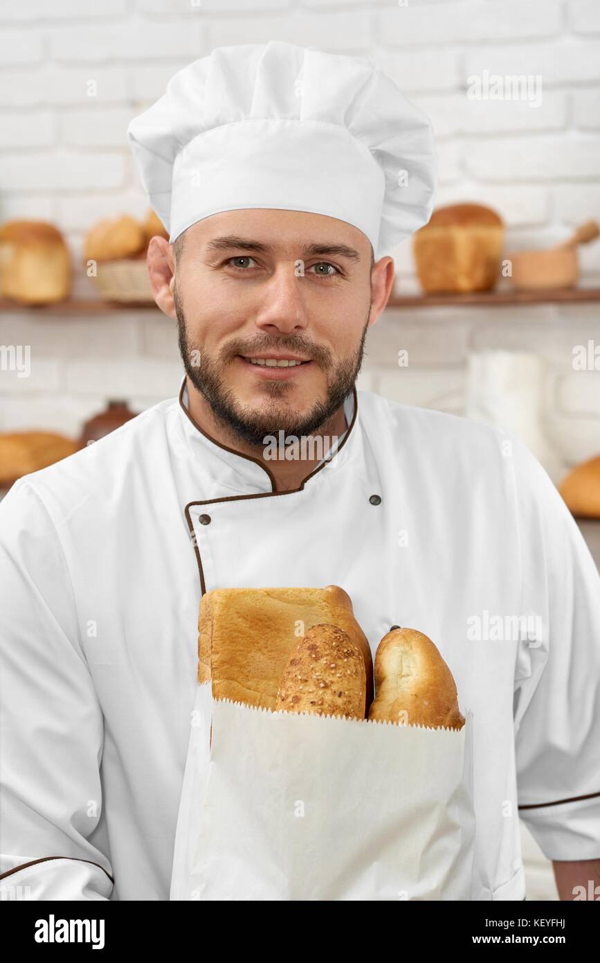 Young man working at his bakery Stock Photo - Alamy