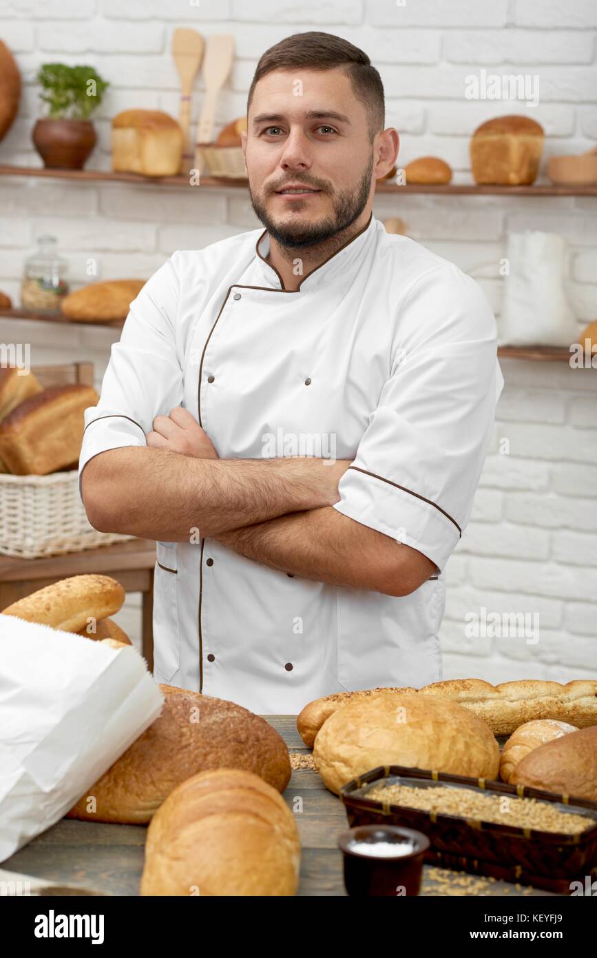 Young man working at his bakery Stock Photo - Alamy