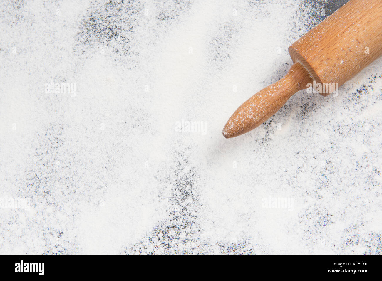 Rolling wooden pin on stone slate with flour Stock Photo - Alamy