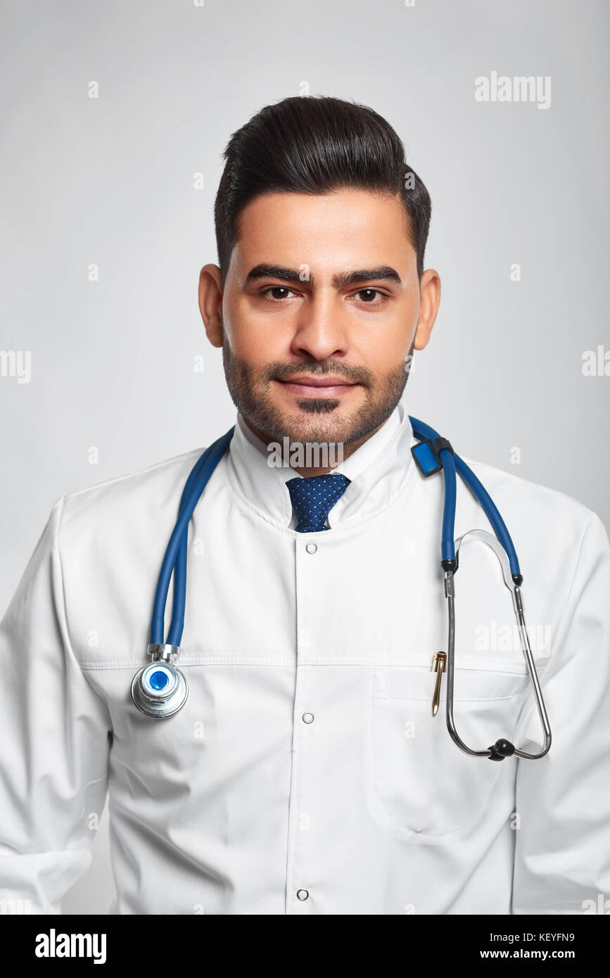Male doctor posing at studio Stock Photo - Alamy
