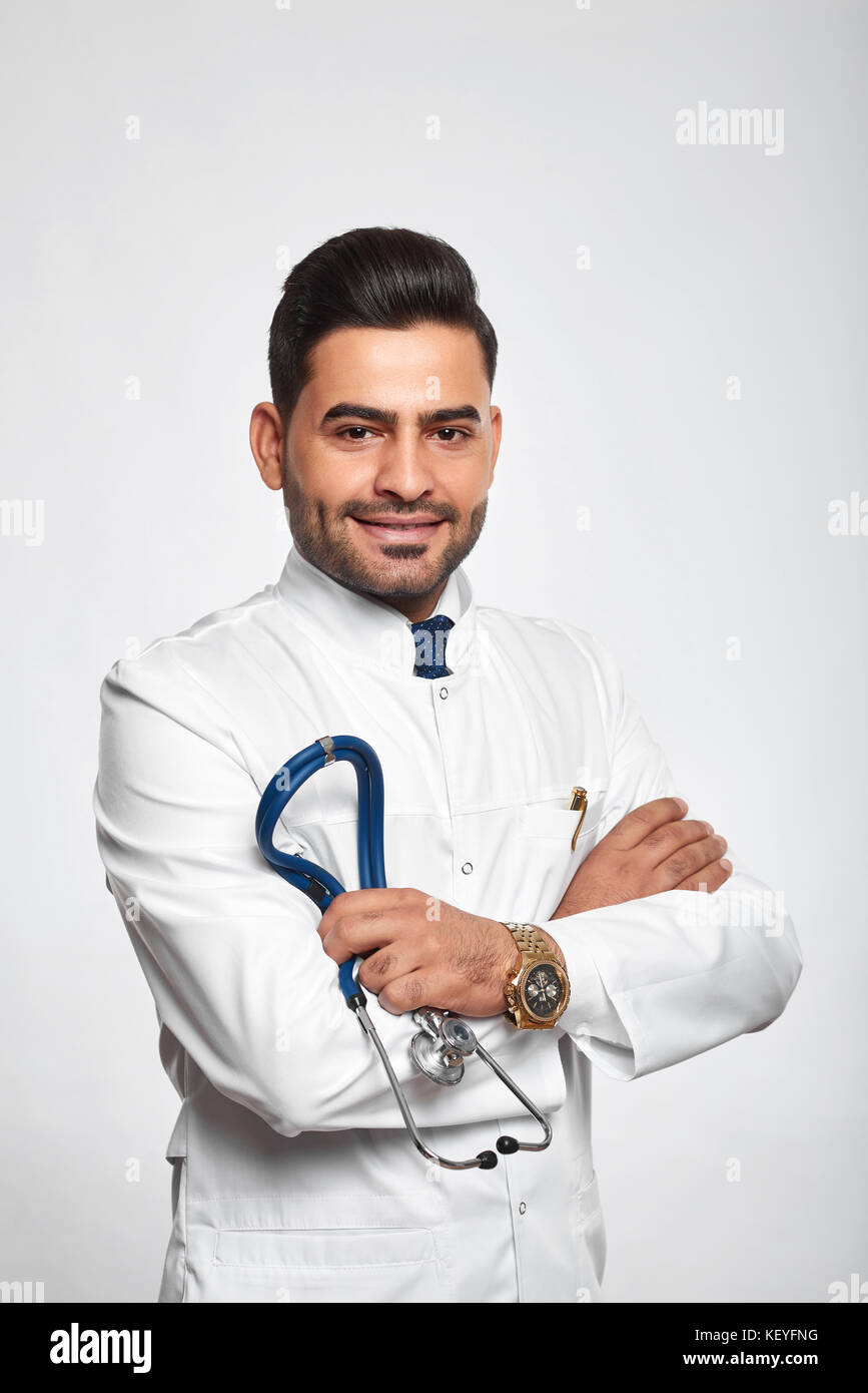 Male doctor posing at studio Stock Photo - Alamy