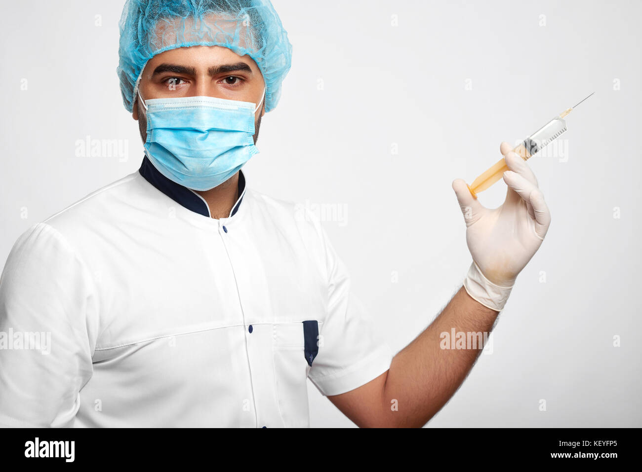 Male doctor posing at studio Stock Photo - Alamy