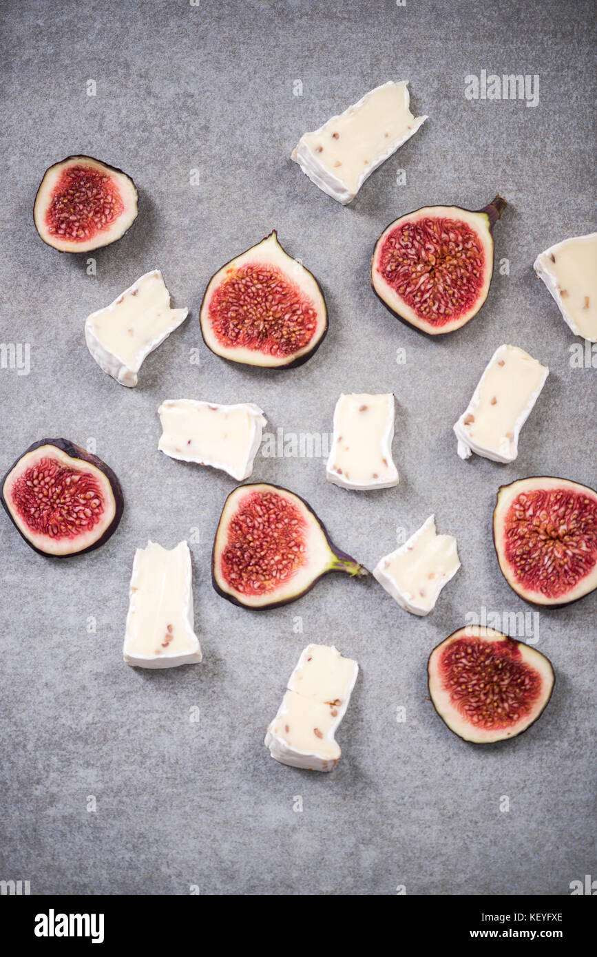 Camembert and fresh figs on stone slate, top view Stock Photo - Alamy