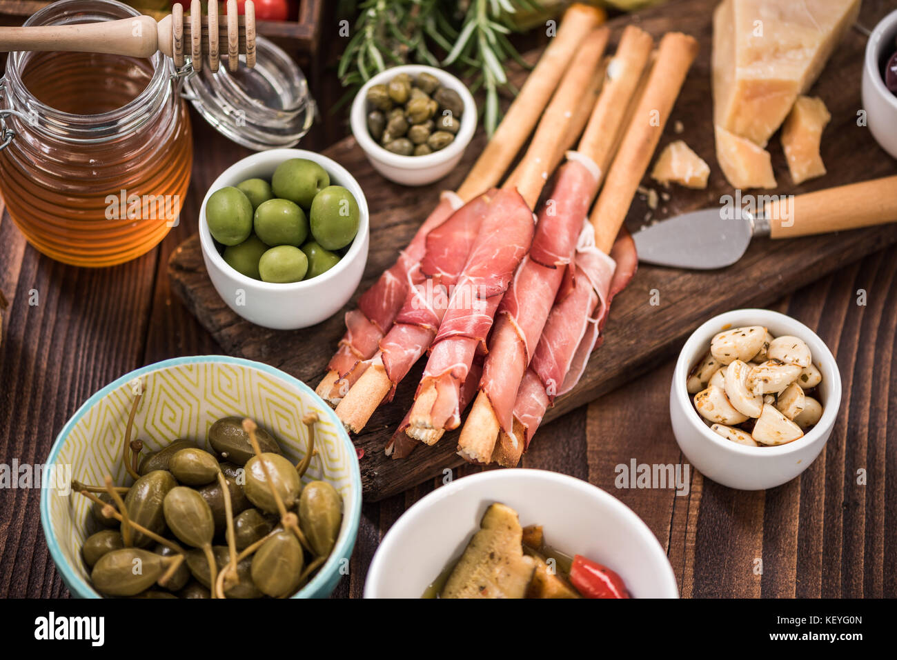 Spanish tapa selection on wooden table Stock Photo - Alamy