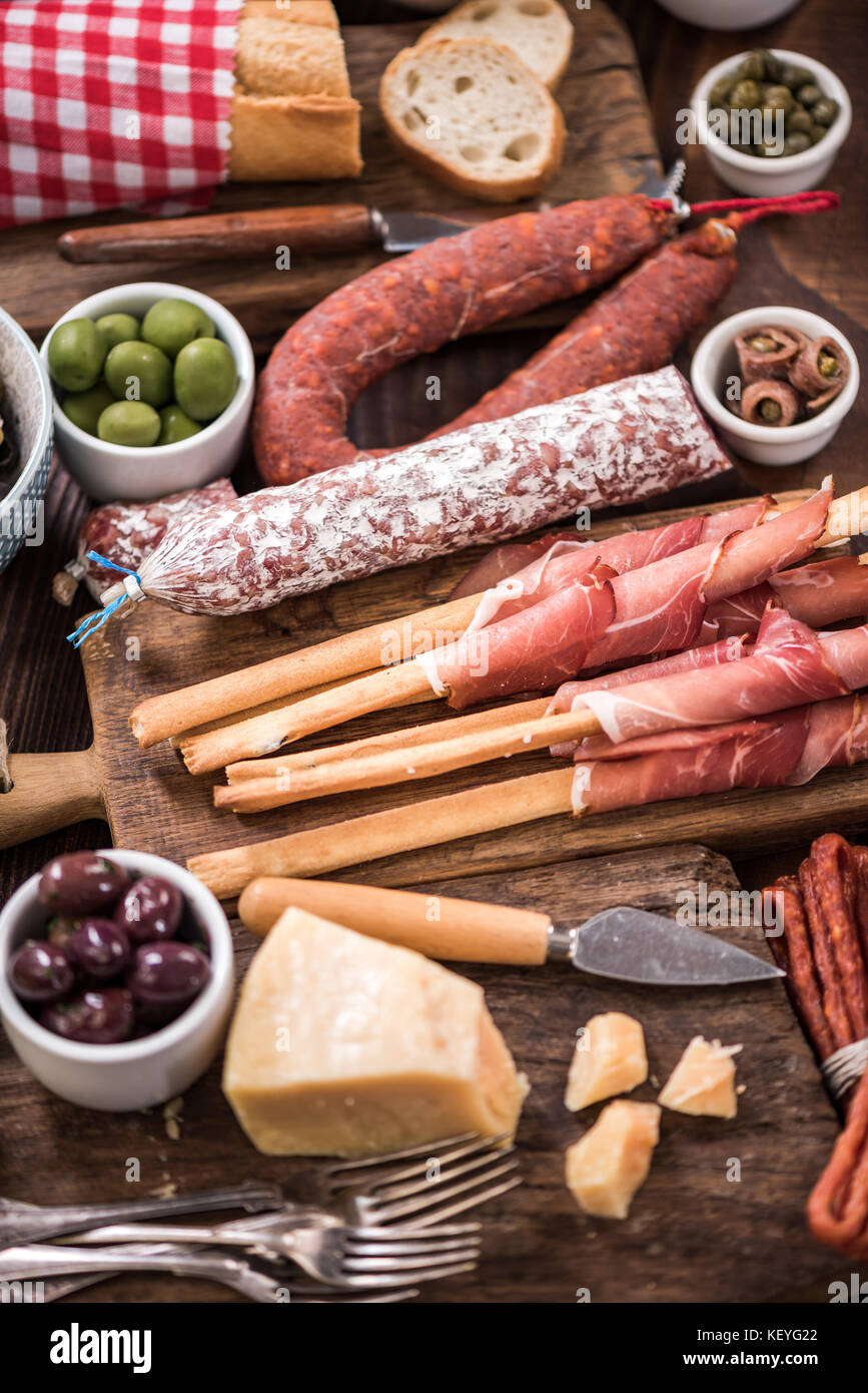 Spanish meat selection on wooden table Stock Photo - Alamy
