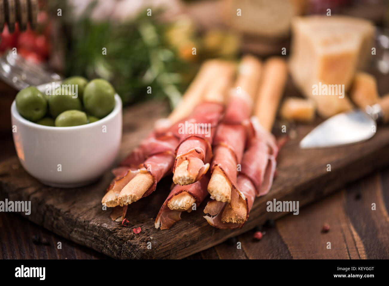 Bread sticks with prosciutto ham,spanish tapa bar food Stock Photo - Alamy