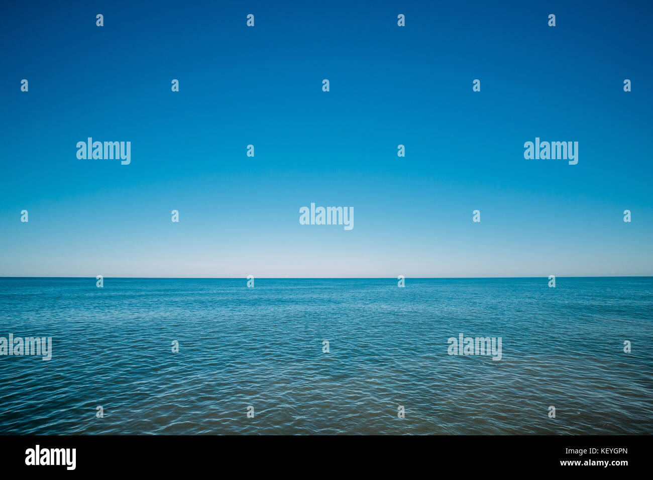 Calm Sea Ocean And Blue Sky Background Stock Photo - Alamy