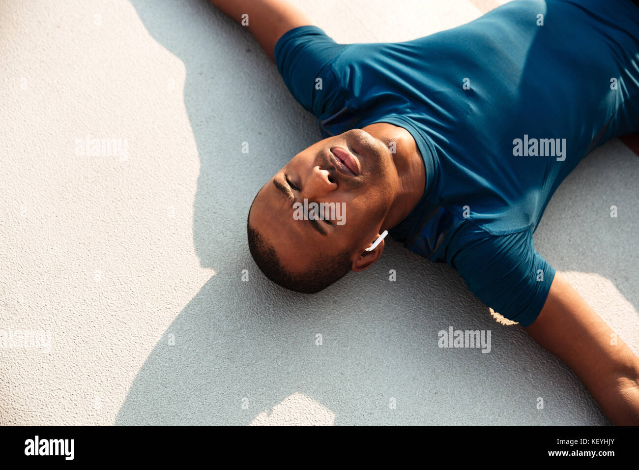 Man lying on ground exhausted hi-res stock photography and images - Alamy
