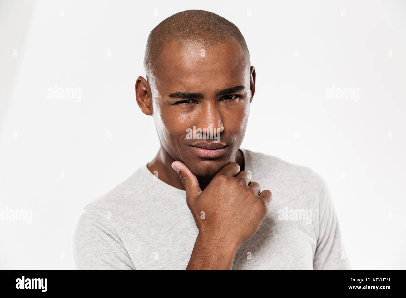 Image of serious young african man thinking isolated over white ...