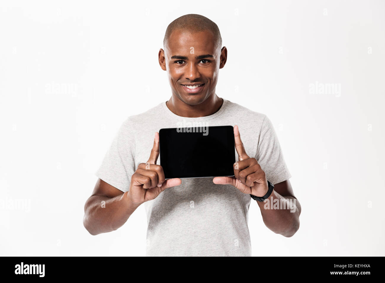 African guy showing tablet hi-res stock photography and images - Alamy