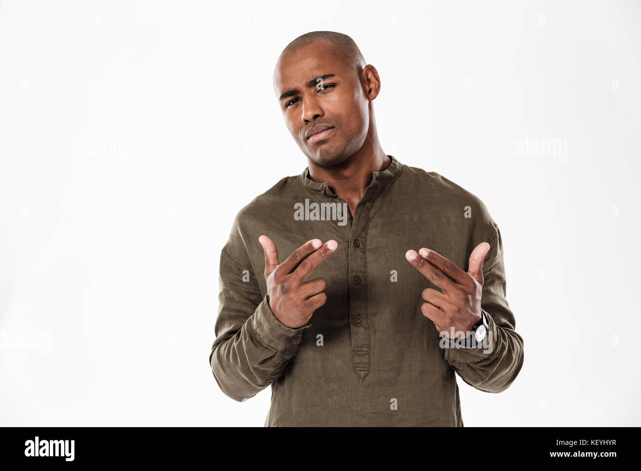 Cool african man showing gun gestures and looking at the camera over ...