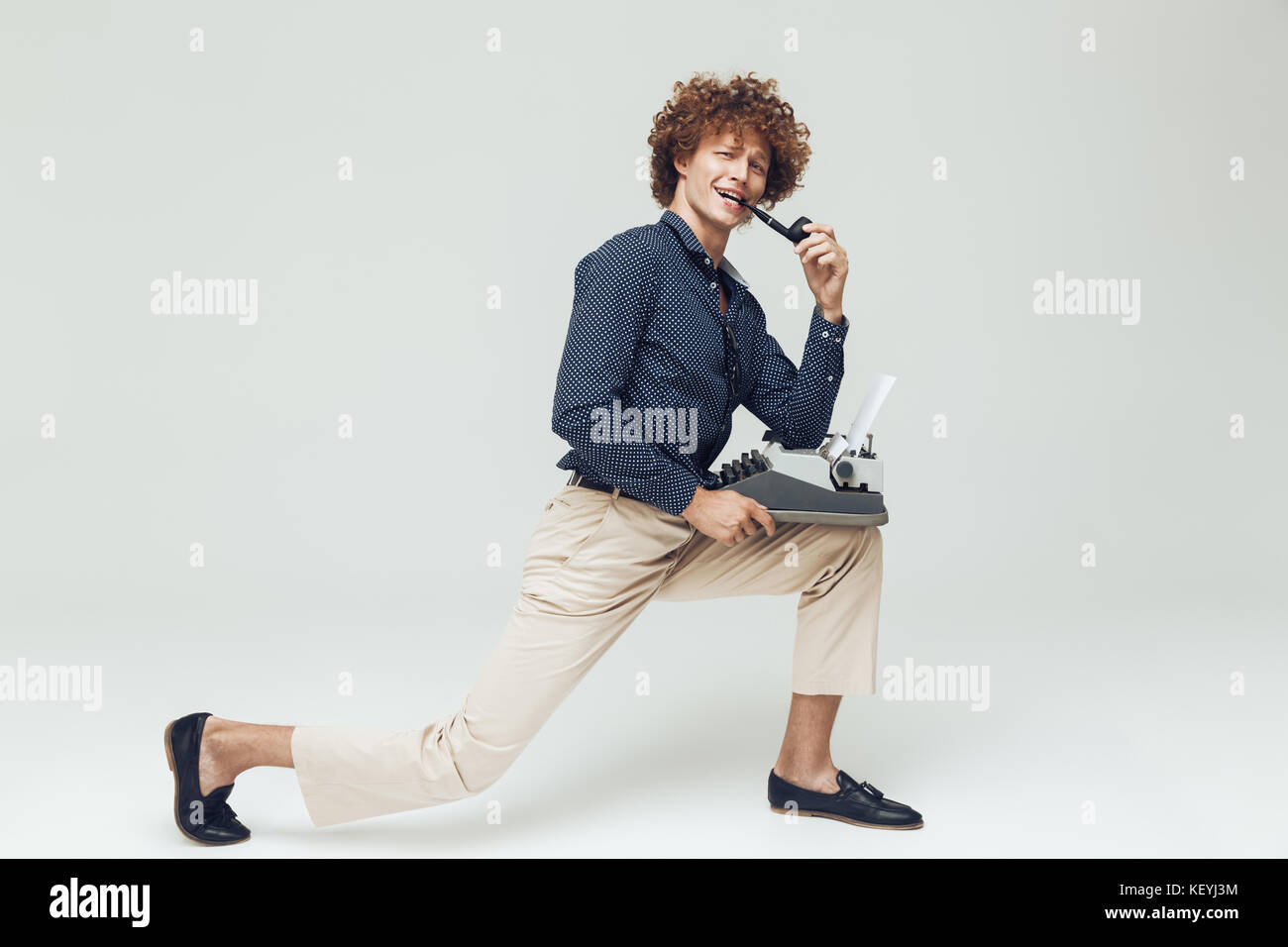 Photo of young happy retro man dressed in shirt sitting and posing ...
