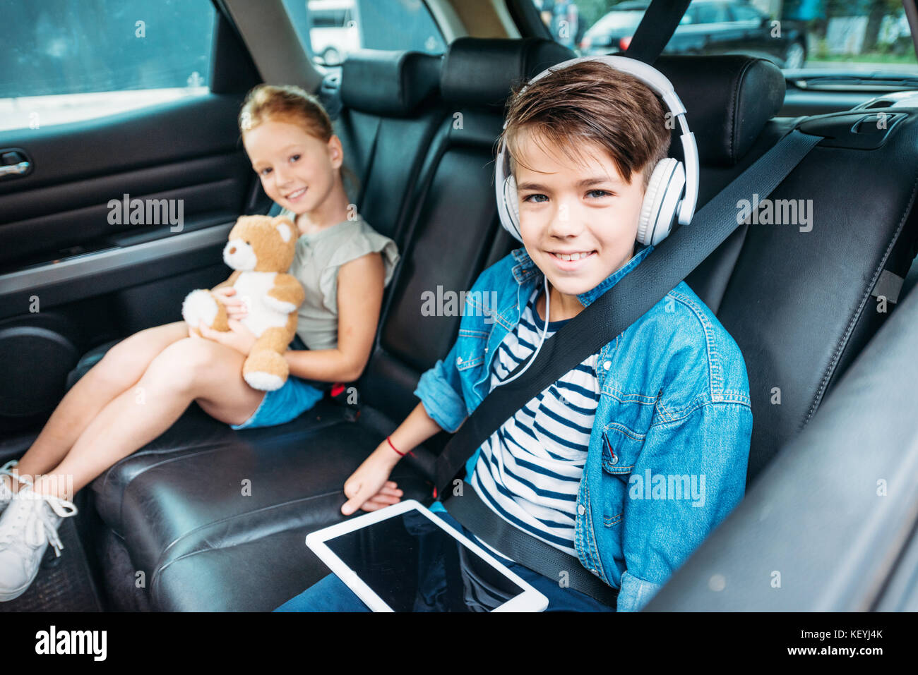 brother and sister ready for car trip Stock Photo - Alamy