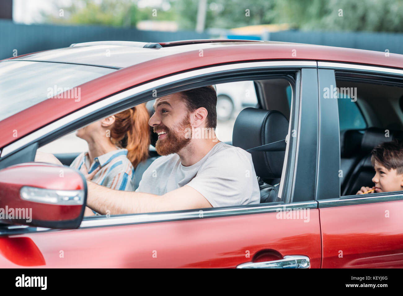 family riding on car together Stock Photo - Alamy