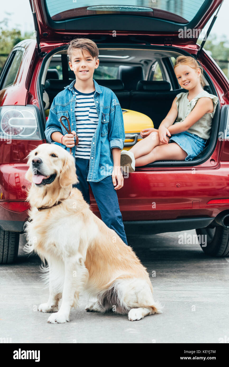 kids with dog in car trunk Stock Photo - Alamy