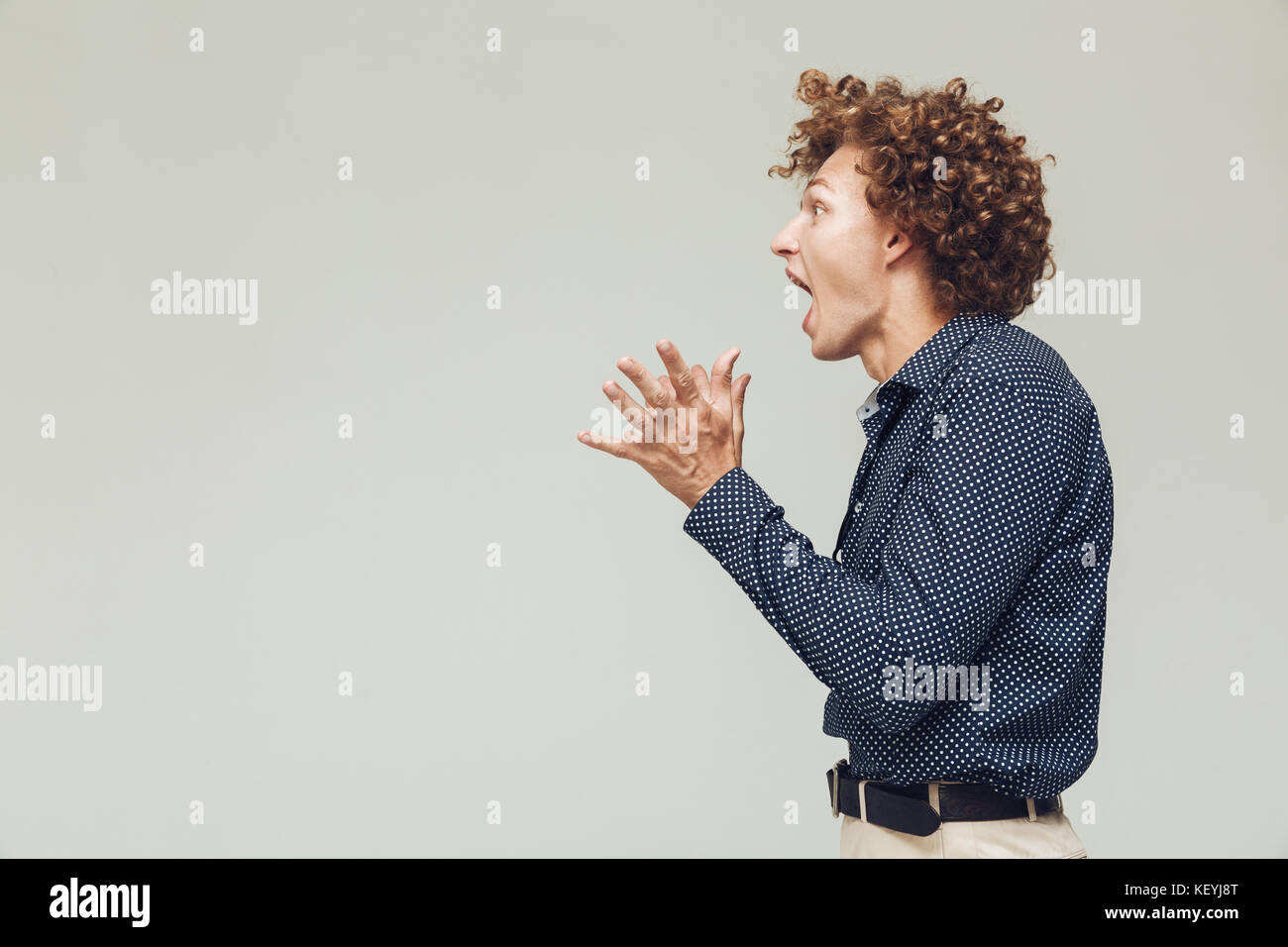 Image of young shocked retro man dressed in shirt standing and posing ...