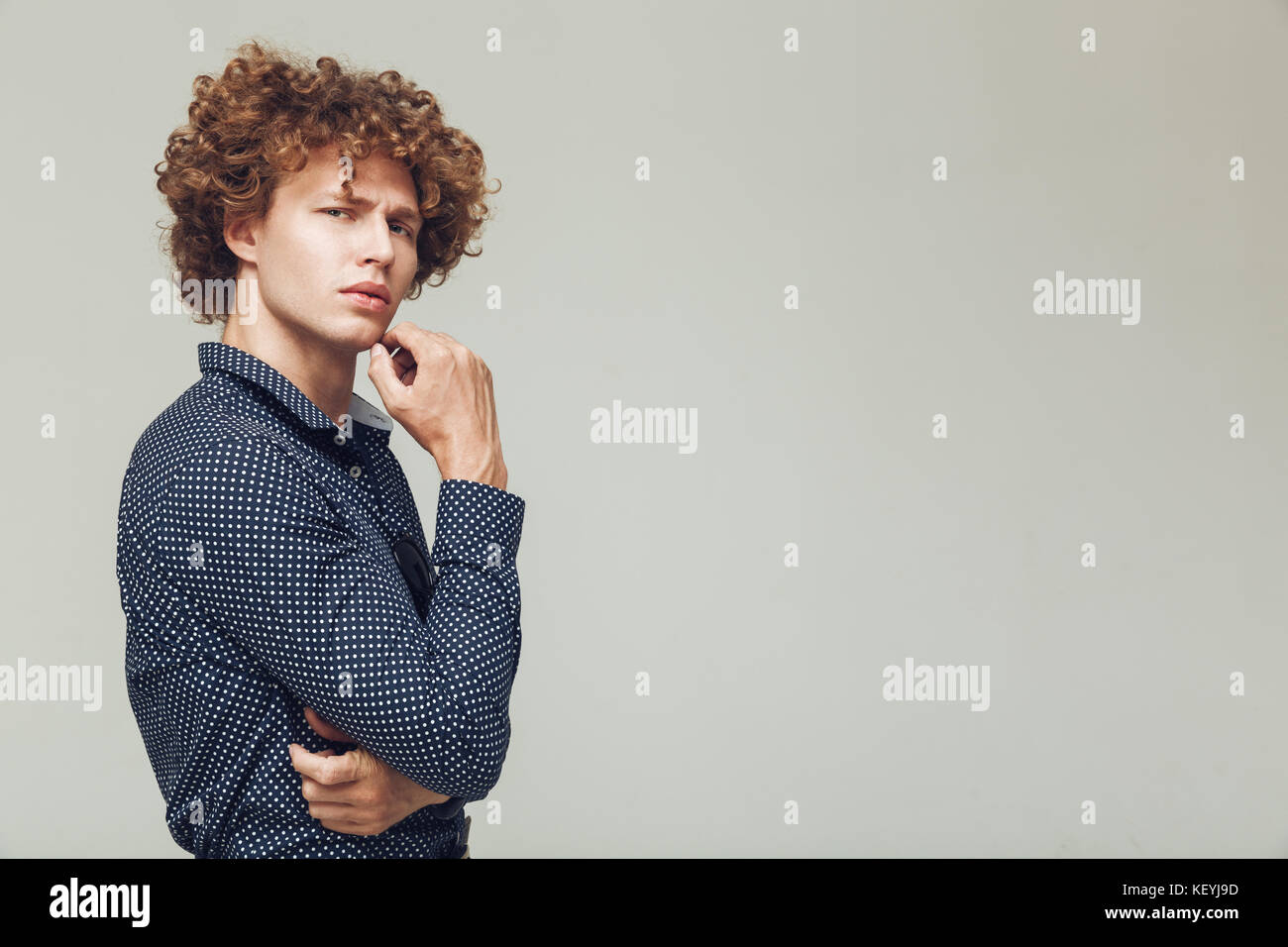 Image of young serious retro man dressed in shirt standing and posing ...