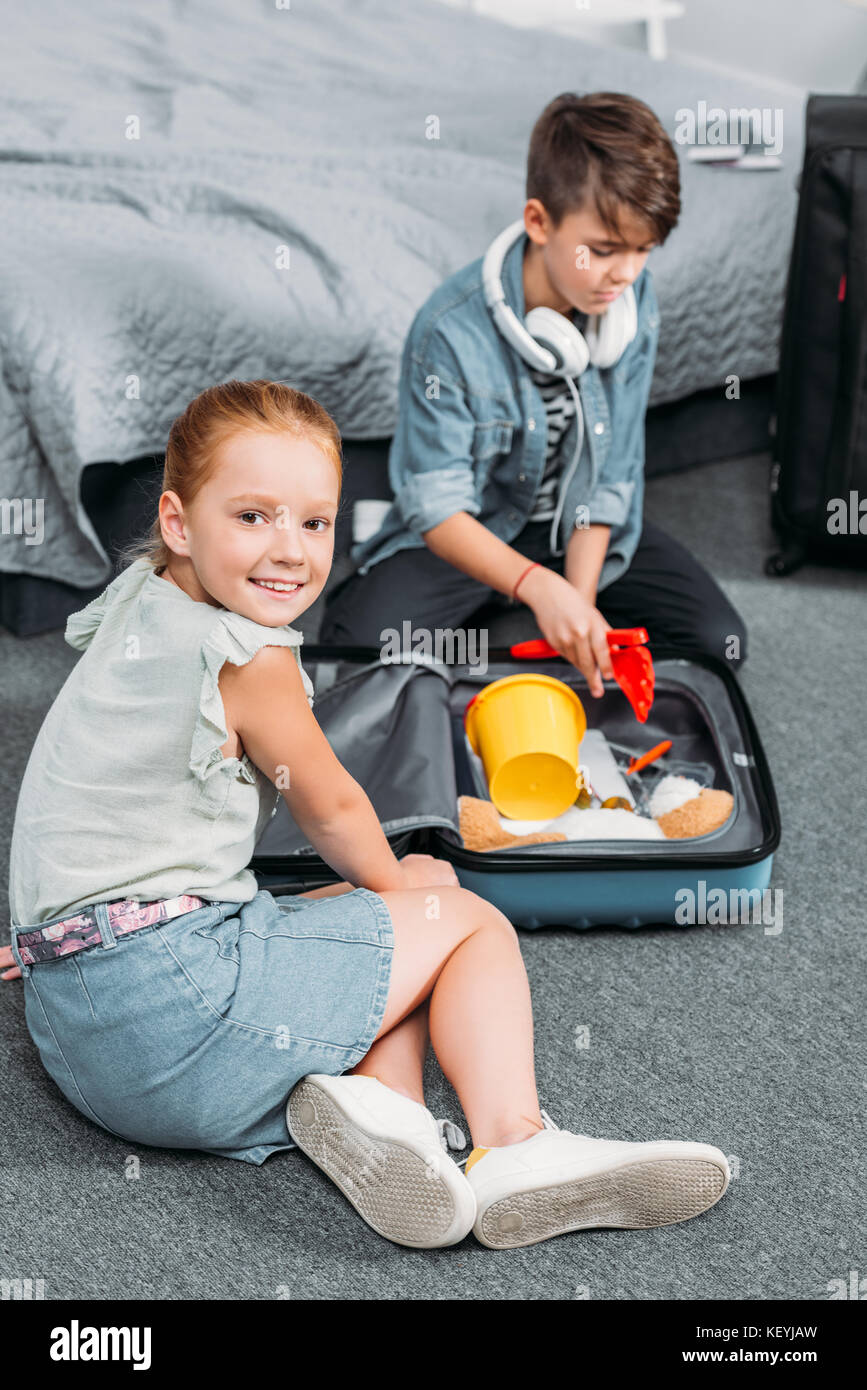 kids packing clothes for trip Stock Photo - Alamy