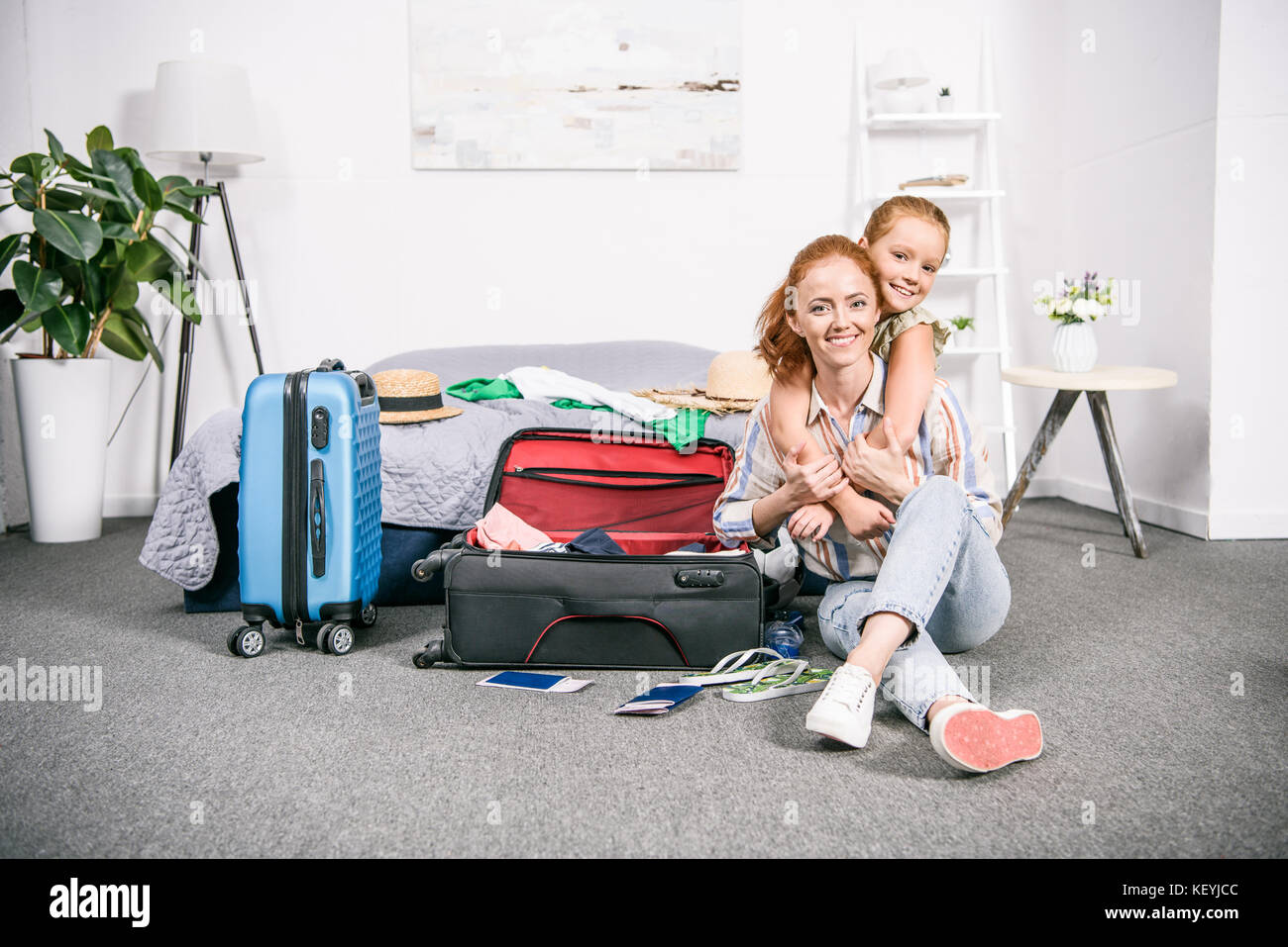 Happy caucasian mother daughter packing hi-res stock photography and ...