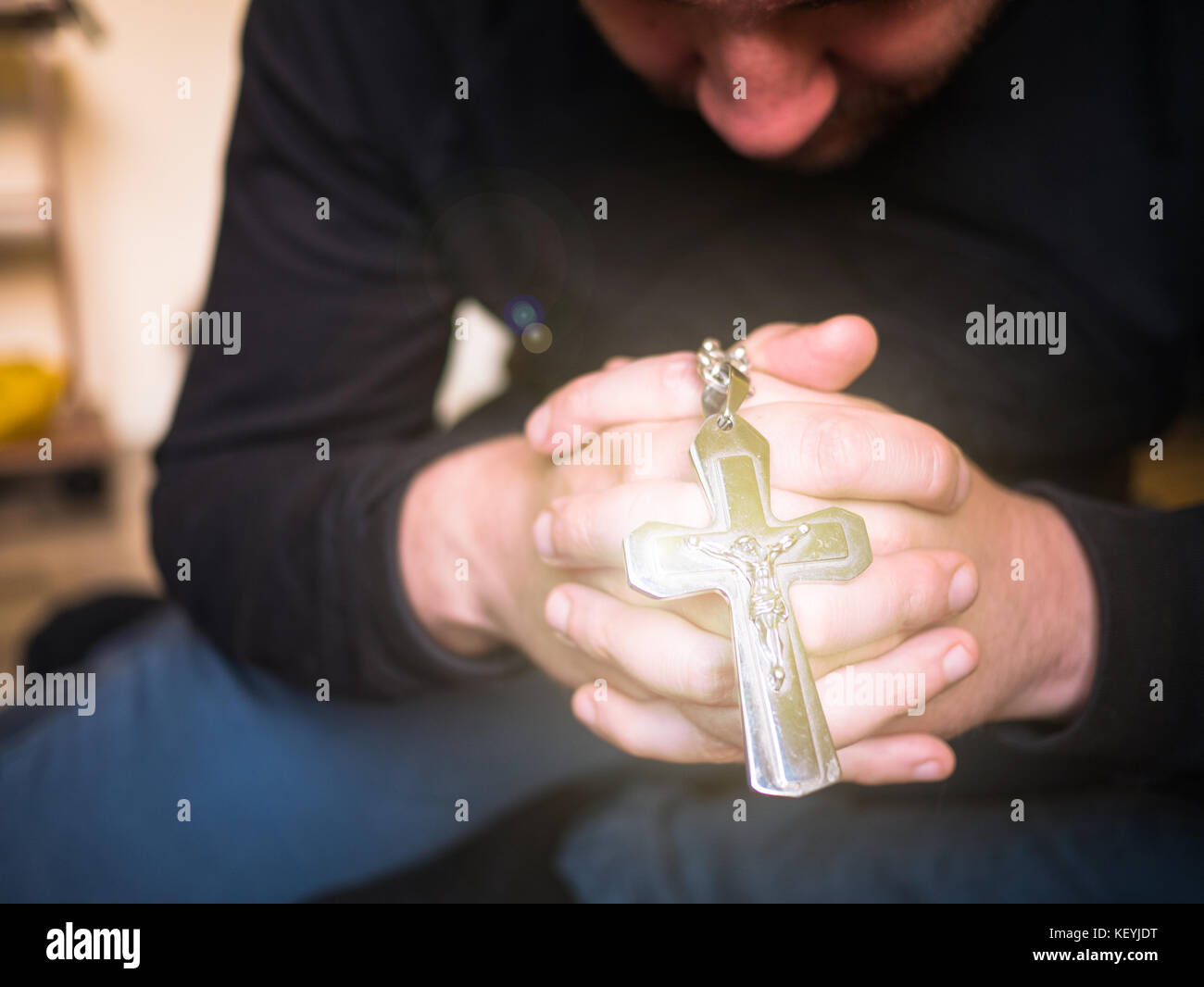 Man Praying At Cross