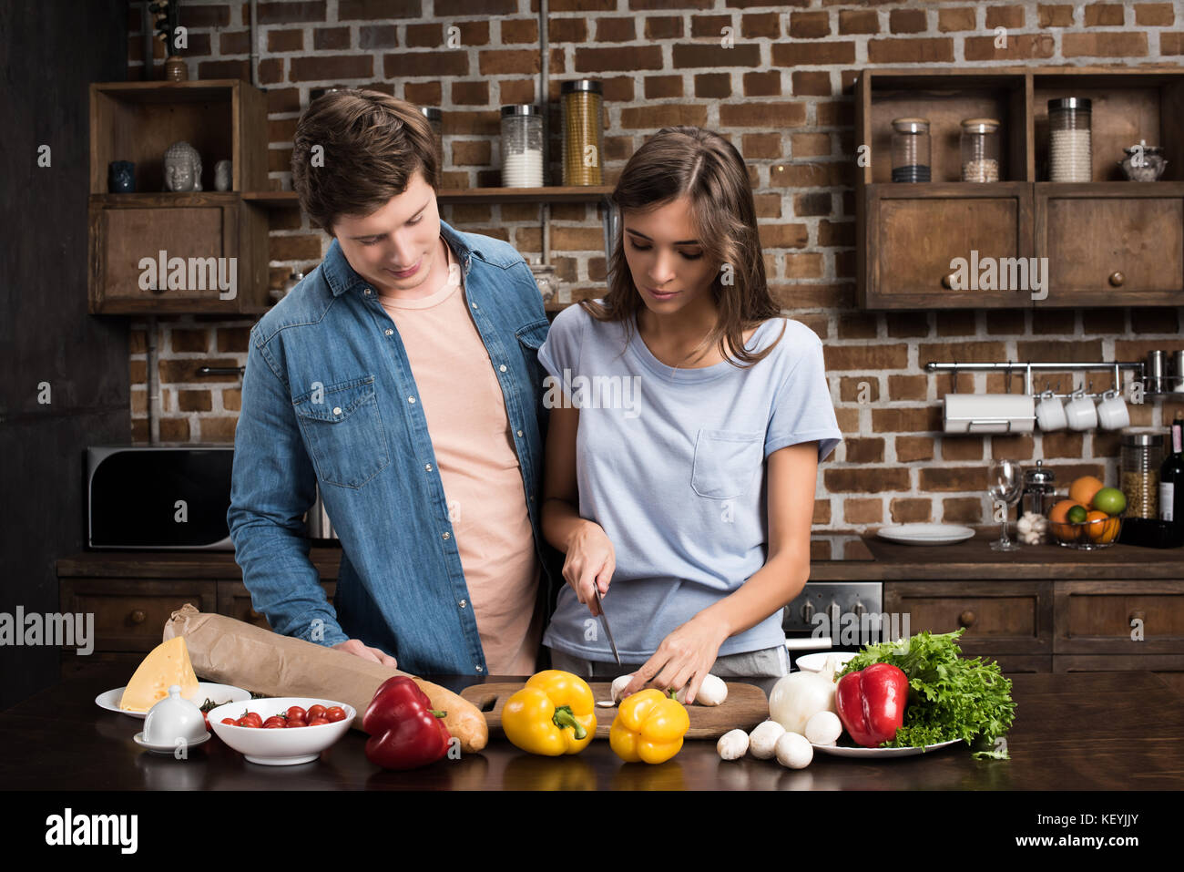 couple cooking dinner at home Stock Photo - Alamy
