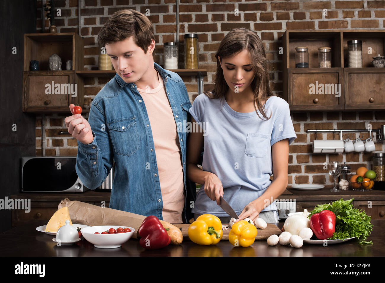 couple cooking dinner at home Stock Photo - Alamy