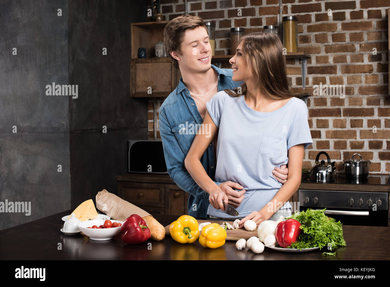 couple cooking dinner at home Stock Photo - Alamy