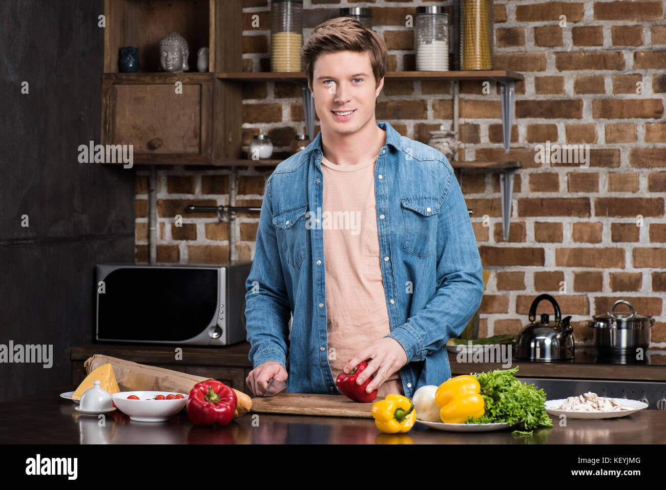 man cooking dinner Stock Photo - Alamy